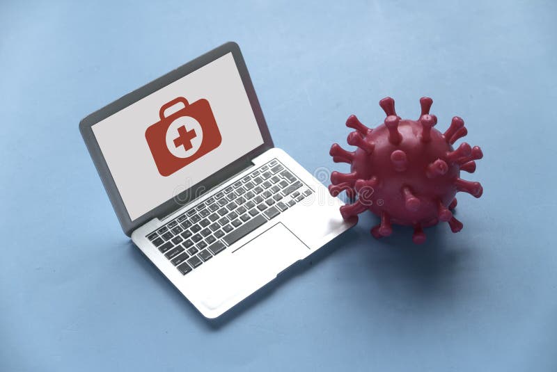 Laptop with Medical Symbol on Screen and Virus Model Stock Photo ...