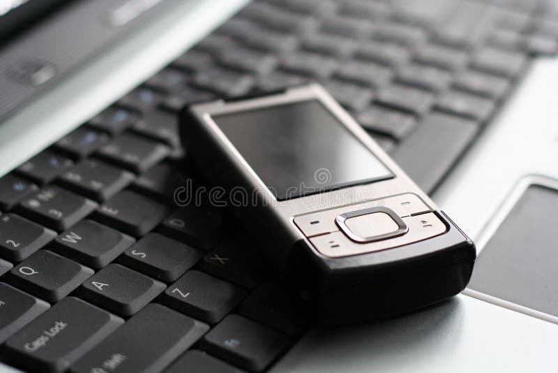 Laptop and mobile phone stock image. Image of bluetooth - 4560771