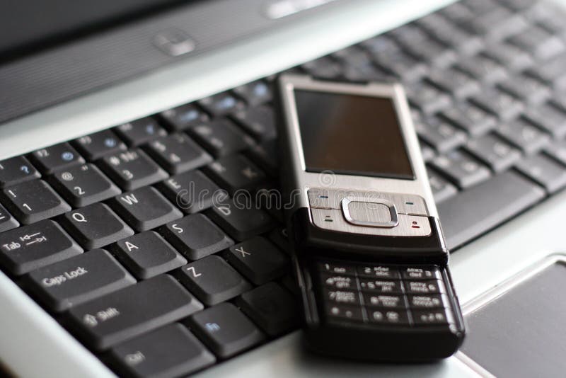 Laptop and mobile phone stock photo. Image of communications - 4560782