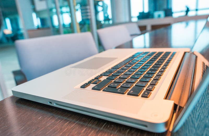 Laptop on a Modern Office Interior Stock Photo - Image of contemporary ...