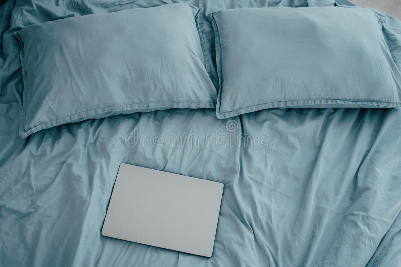 Laptop in the Morning on a Blue Sheets Bed. Work from Home. Freelance ...