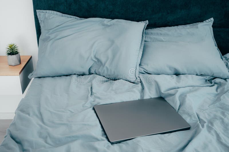 Laptop in the Morning on a Blue Sheets Bed. Work from Home. Freelance ...