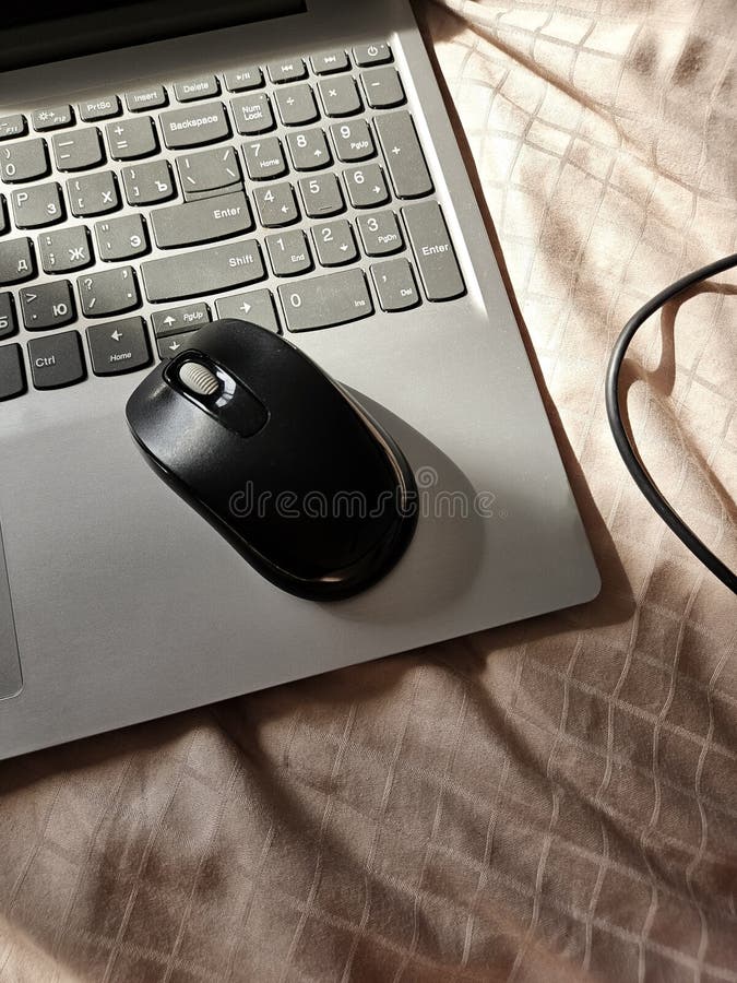 Laptop and Mouse on Bed with Sunlit Texture Stock Image - Image of ...