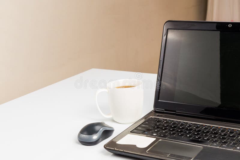 Laptop and Mouse with a Cup of Coffee on Office Desk Stock Photo ...