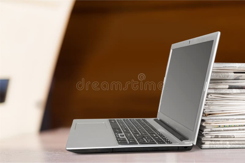 Laptop and Newspapers stock image. Image of data, medium - 59855777