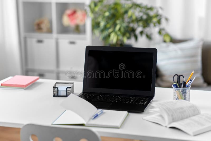 Laptop, Notebook and Book on Table at Home Office Stock Image - Image ...