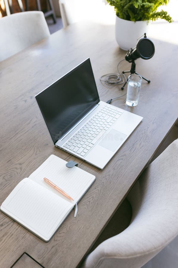 Laptop, Notebook, and Microphone on Wooden Table for Home Office Setup ...