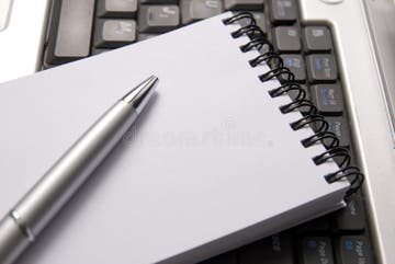 Laptop, notebook and a pen stock photo. Image of idea - 6021418