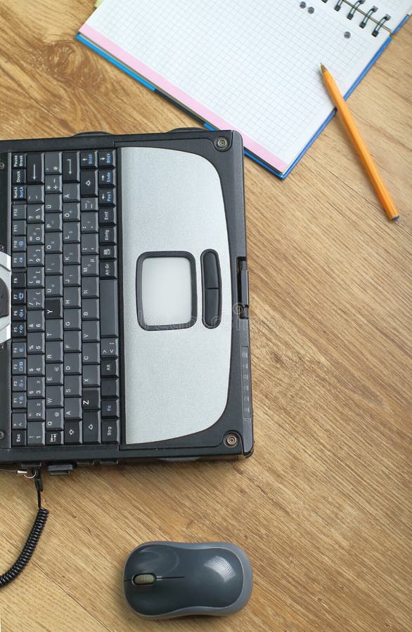 A Laptop with a Notebook and a Pen on the Panels Stock Photo - Image of ...