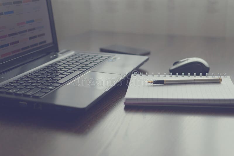 Laptop, notebook and pen editorial image. Image of mobile - 63123115