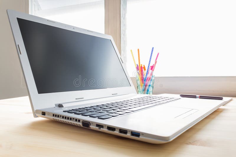 Laptop and Notebook and Pen on Wood Table Stock Photo - Image of ...