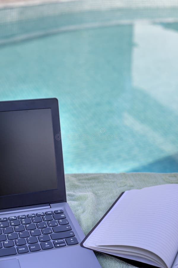 Laptop and Notebook on a Towel by the Pool, Pool Office Stock Image ...
