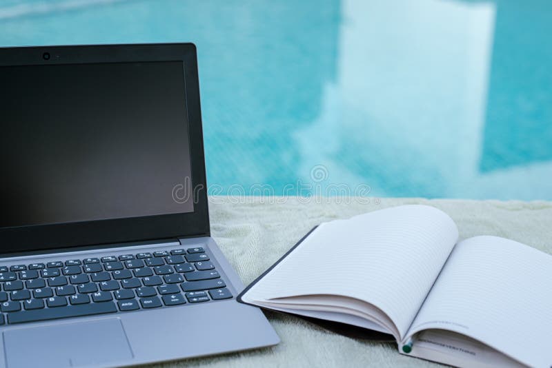 Laptop and Notebook on a Towel by the Pool, Summer Office in the Pool ...