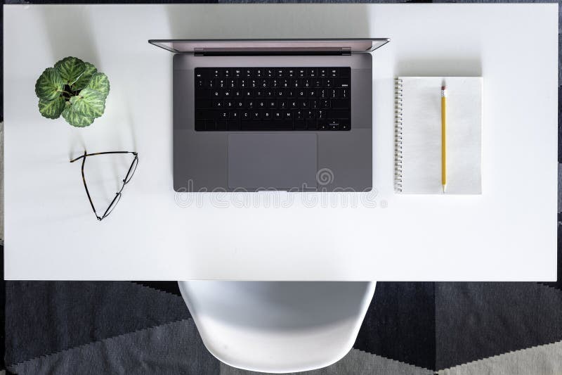 Laptop, Notepad, Glasses and Flowerpot on the Desktop, Top View. Stock ...