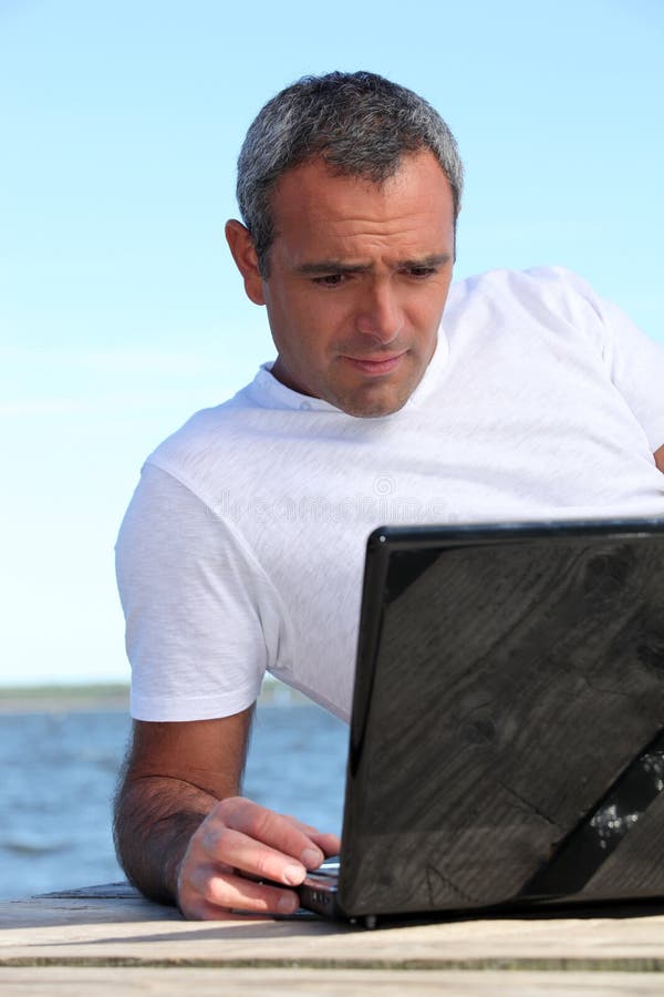 Laptop by the ocean stock image. Image of computer, communication ...