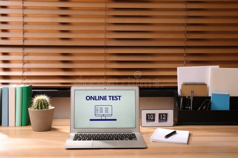 Laptop with Online Test on Wooden Desk in Office Stock Image - Image of ...
