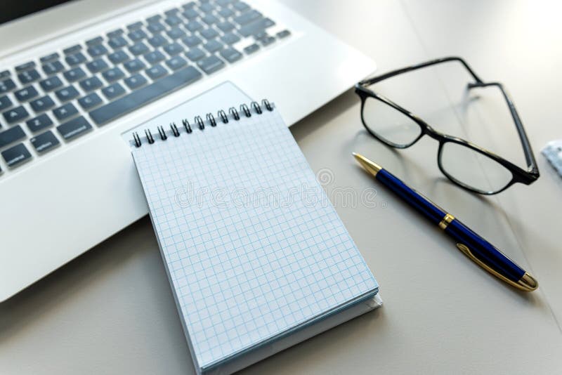 Laptop Pen with Blank Empty Notepad in Office Desk. Stock Image - Image ...