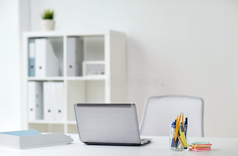 Laptop with Pen and Stickers on Office Table Stock Photo - Image of ...