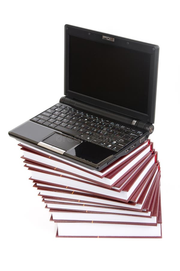 Laptop on a pile of books stock photo. Image of isolated - 13526172