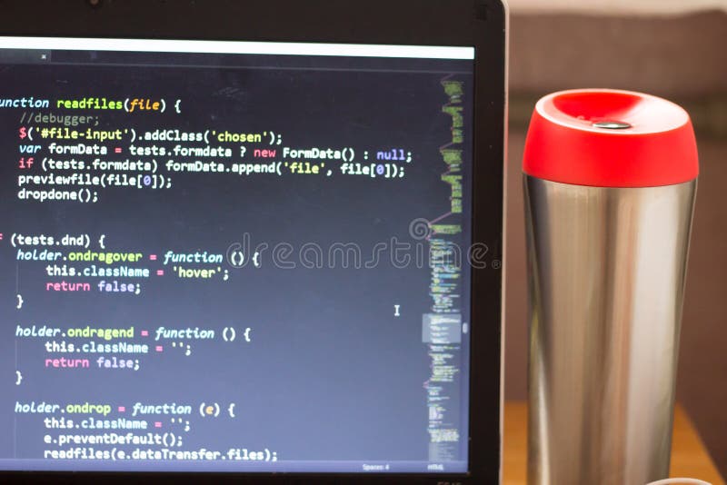 Laptop with Programming Web Code and Red Capped Flask Aside Stock Photo ...