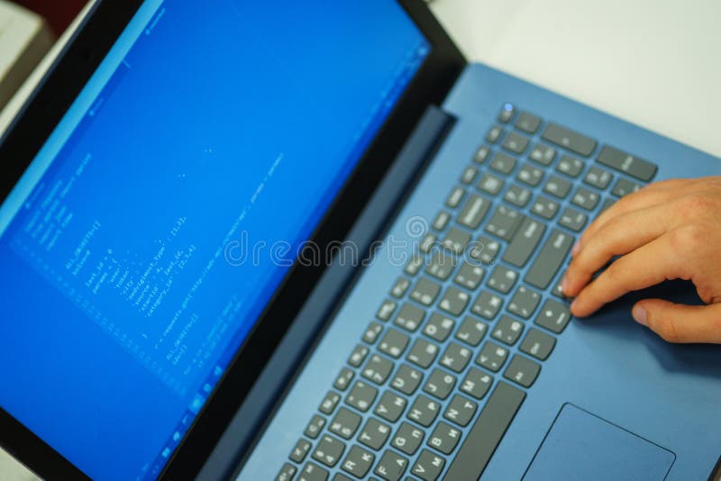 Laptop Screen with Lines of Code. Programmer Writes an Application in ...