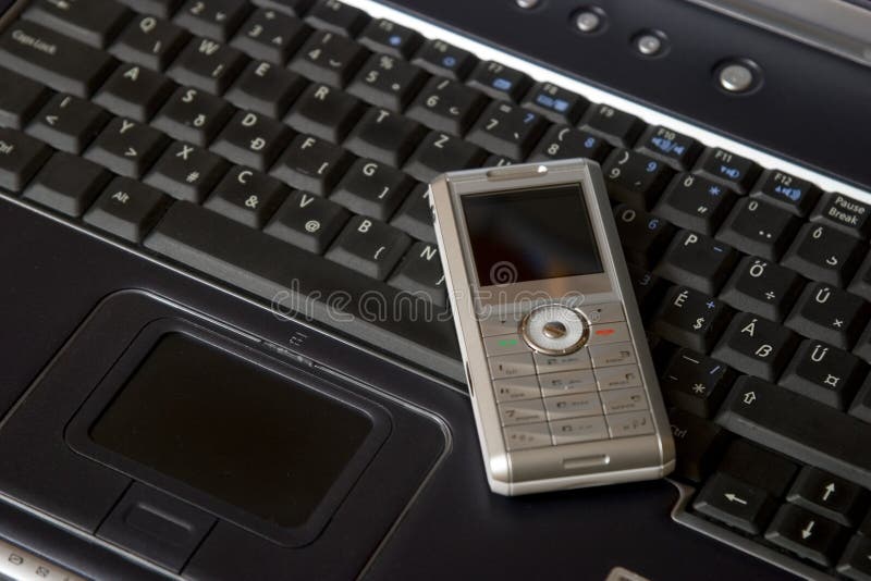 Laptop and Silver Smart Phone Stock Image - Image of communication ...