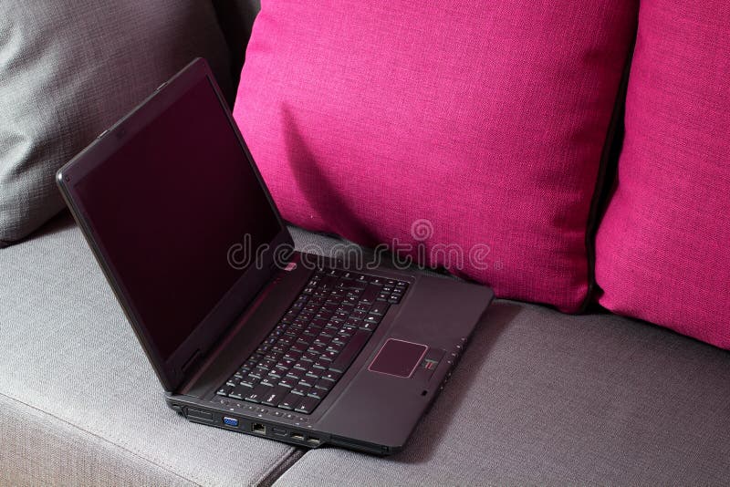 Laptop on sofa stock image. Image of laptop, keyboard - 29395413