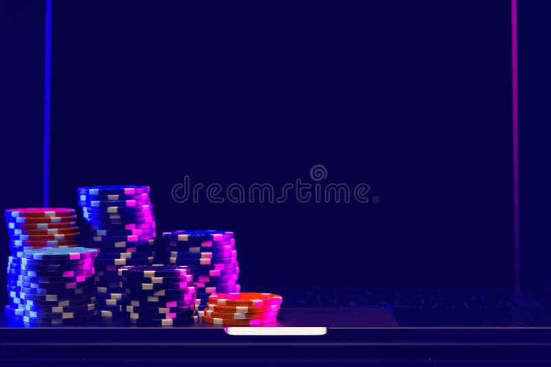 Laptop with Stacks of Poker Chips on Green Felt Stock Photo - Image of ...