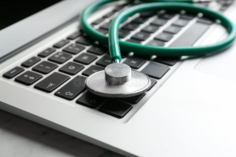 Laptop and Stethoscope on Light Grey Table, Space for Text. Concept of ...