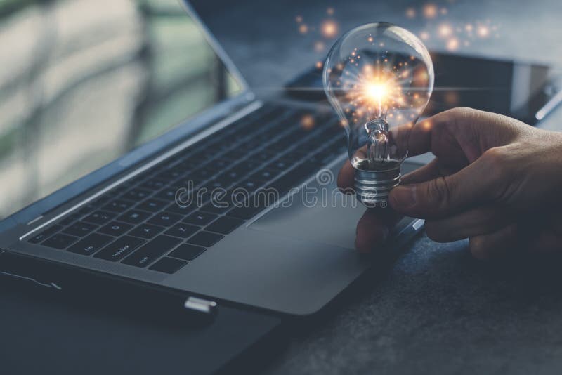 Laptop and Tablet with Glowing Light Bulb. Self Learning or Education ...