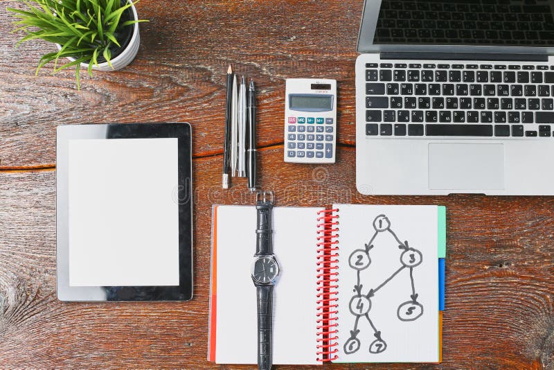Laptop, Tablet and Notebook are on a Wooden Table Stock Image - Image ...
