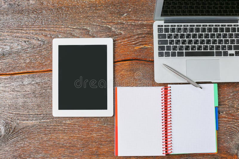 Laptop, Tablet and Notebook are on a Wooden Table Stock Image - Image ...