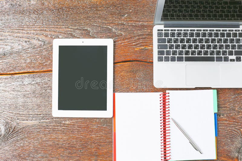 Laptop, Tablet and Notebook are on a Wooden Table Stock Photo - Image ...