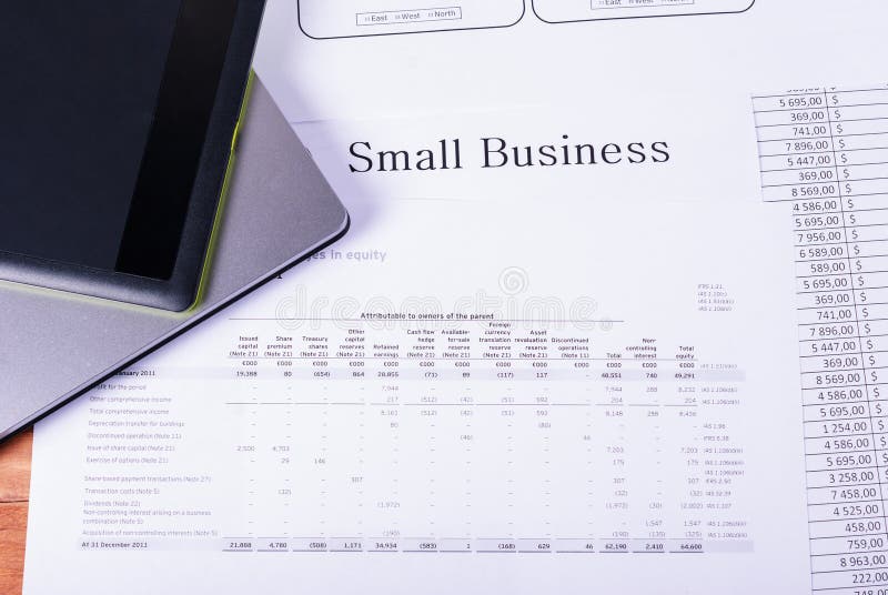 Laptop and Tablet at Office Desk with Documents Stock Photo - Image of ...