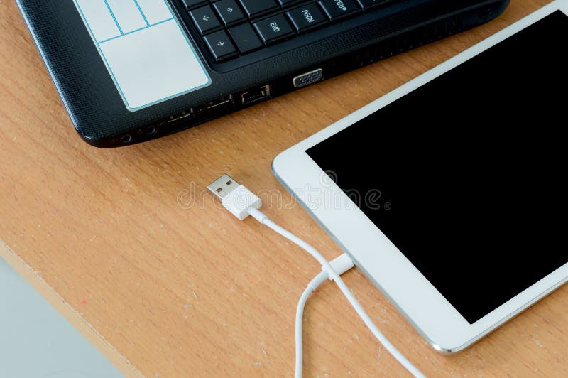 Laptop Tablet and Usb Cable on Wooden Desk Stock Photo - Image of place ...