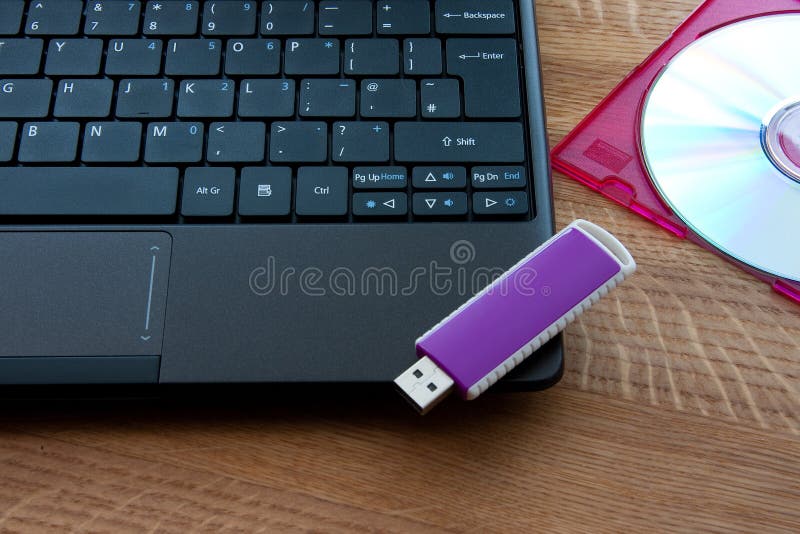 Laptop, USB drive and CD stock image. Image of color - 22694579