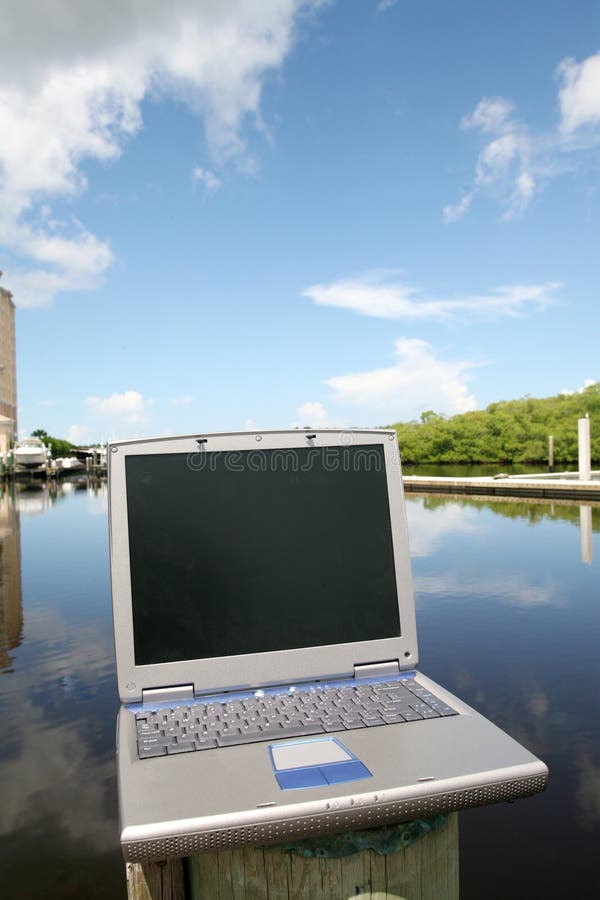 Laptop on the water stock photo. Image of tropics, condo - 6566760