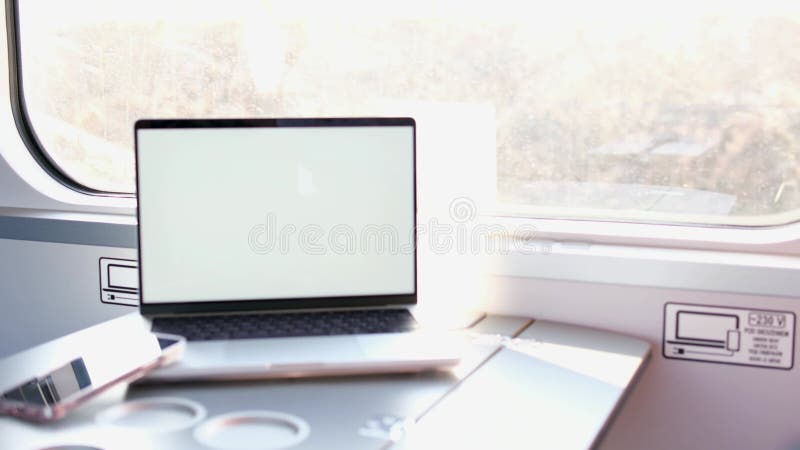 Laptop with White Screen in the Train Moving Wagon in the Background ...