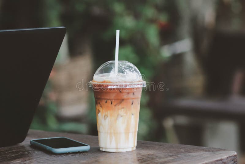 Laptop on Wooden Desk with Iced Coffee in the Cafe Stock Image - Image ...