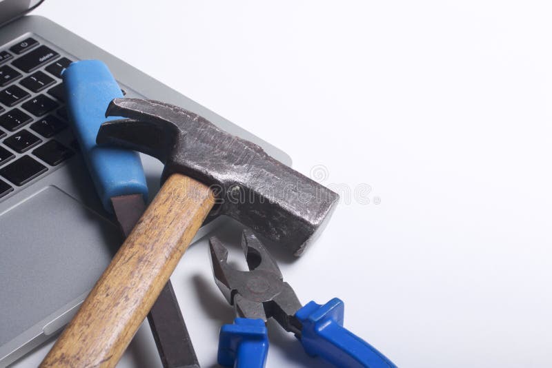 Laptop and Work Tools. on the White Surface of the Table is a Tablet ...