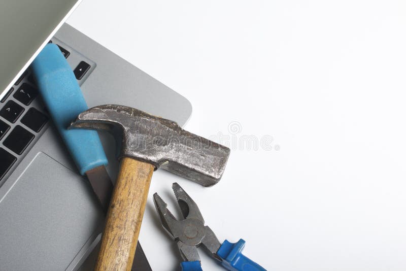 Laptop and Work Tools. on the White Surface of the Table is a Tablet ...