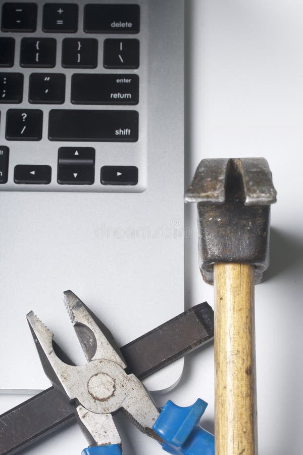 Laptop and Work Tools. on the White Surface of the Table is a Tablet ...