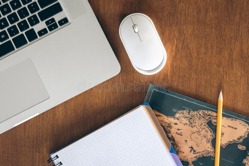 Laptop, World Map and Notebook on a Wooden Table, Top View. Stock Image ...