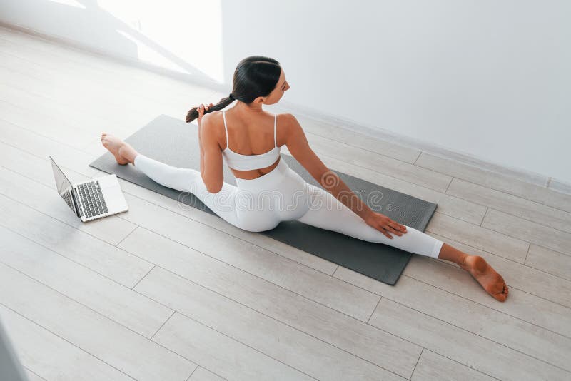 With Laptop Young Caucasian Woman With Slim Body Shape Is Indoors At Daytime Stock Image