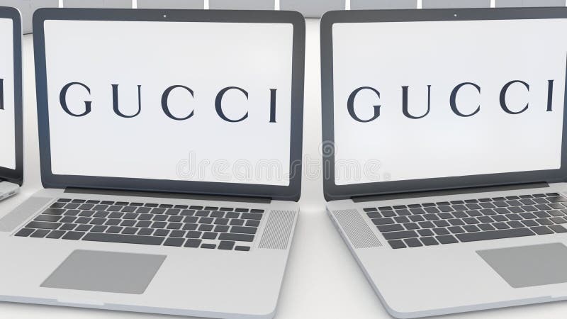 Laptops with Gucci Logo on the Screen. Computer Technology Conceptual ...