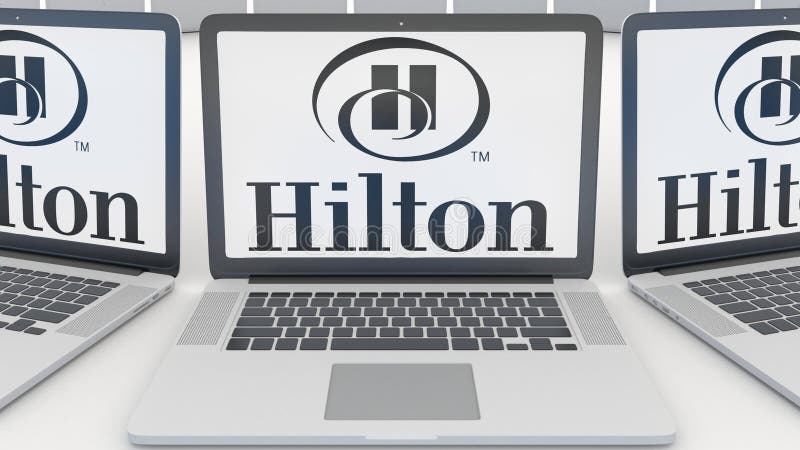 Laptops with Hilton Hotels Resorts Logo on the Screen. Computer ...