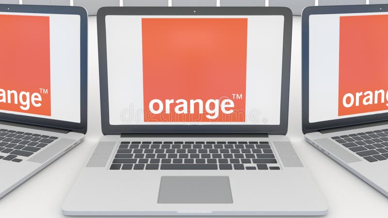 Laptops with Orange S.a. Logo on the Screen. Computer Technology ...