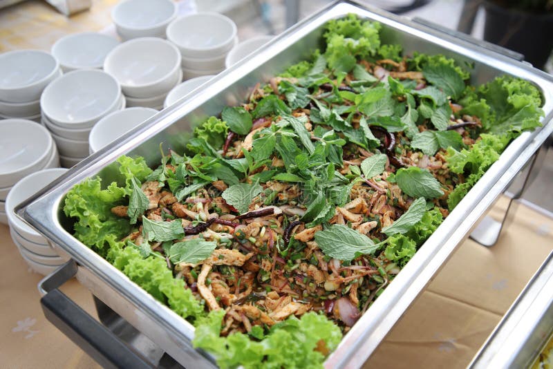 Larb Moo, Sprinkled on Top with Mint Leaves in Buffet Line. the Container is a Rectangular ...