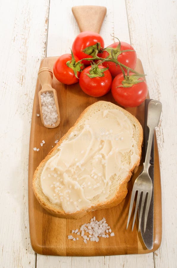 Lard Bread with Coarse Salt and Tomatoes Stock Photo - Image of fork ...
