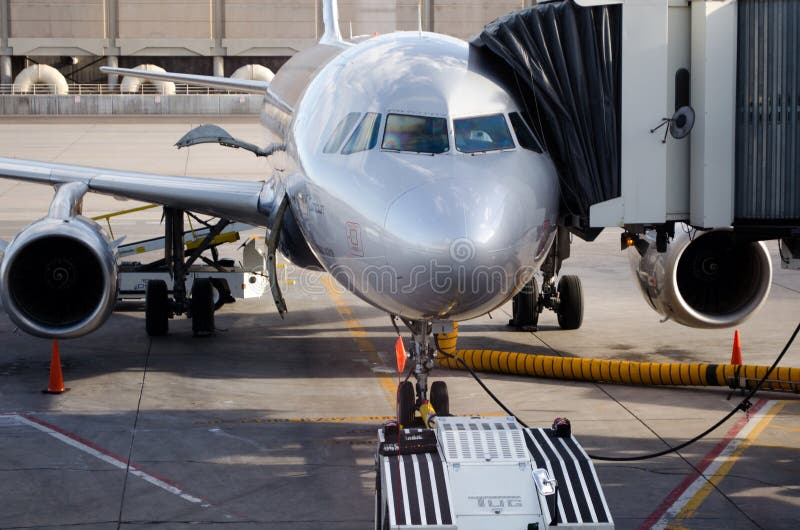 Large airplane loading up editorial photography. Image of loading ...